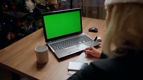 Woman working write on paper on green sc... | Stock Video | Pond5