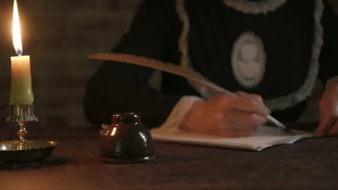 Woman writing letter with a quill pen | Stock Video | Pond5