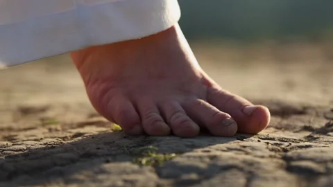 woman's bare foot dragging her toes acro... | Stock Video | Pond5