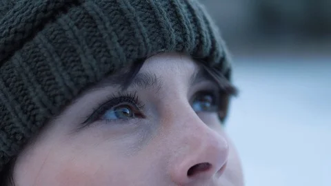 Woman's Eyes Looking Up in Cold Winter S... | Stock Video | Pond5