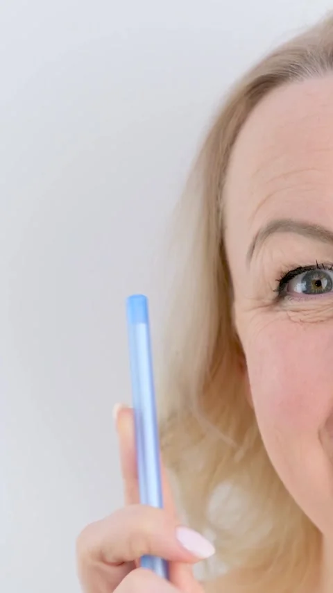 woman's face close-up looks into the fra... | Stock Video | Pond5