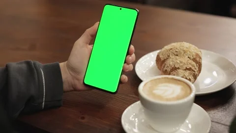 Woman`s Hand is Holding Chroma Key Green... | Stock Video | Pond5
