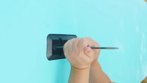 The woman's hand inserts and removes the... | Stock Video | Pond5