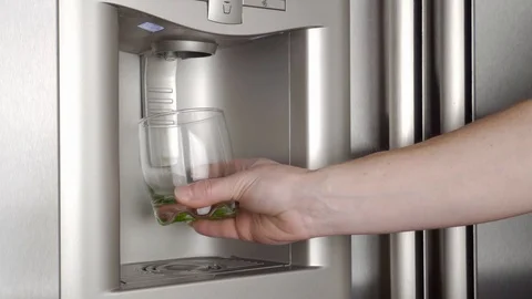 The woman's hand pours cold water from t... | Stock Video | Pond5