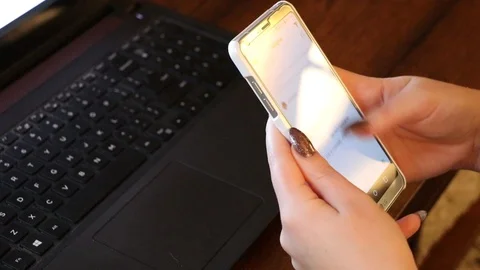 A Woman's hand scrolling through a phone... | Stock Video | Pond5
