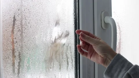 A womans hand touching wet window glass ... | Stock Video | Pond5