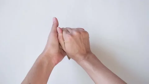 Woman's hands crumpled into a lump drawi... | Stock Video | Pond5