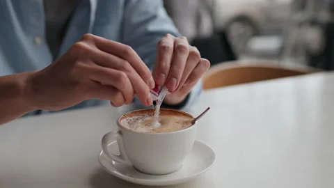 Woman's hands put sugar packaging in rea... | Stock Video | Pond5