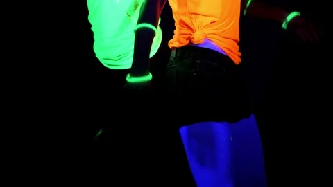 Women dancing in UV blacklight, glow par... | Stock Video | Pond5
