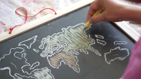 women hand with a chalk drawing world ma... | Stock Video | Pond5