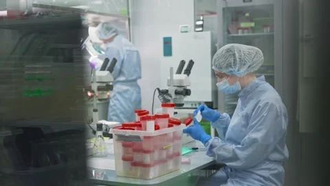 Women work in the lab. Conducts experime... | Stock Video | Pond5