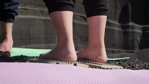 Women's feet step on a Sadhu board with ... | Stock Video | Pond5