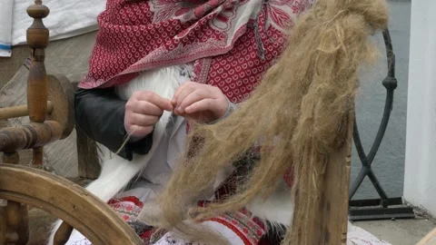 Women's hands spin a thread on an old sp... | Stock Video | Pond5