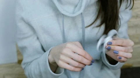 Women's hands turn white spinner close-u... | Stock Video | Pond5