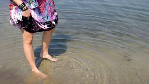 Women's legs in the sandy shallowsplay w... | Stock Video | Pond5