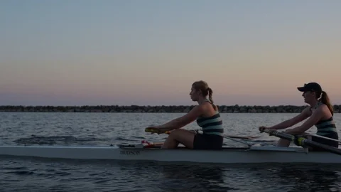 Women's quad rowing team training on lak... | Stock Video | Pond5