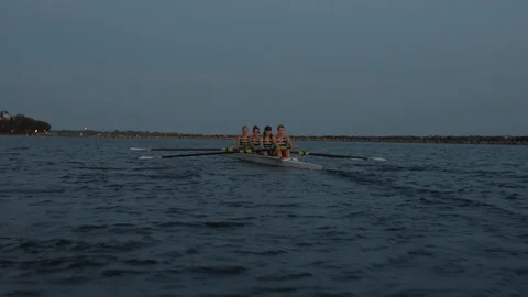 Women's quad rowing team training on lak... | Stock Video | Pond5