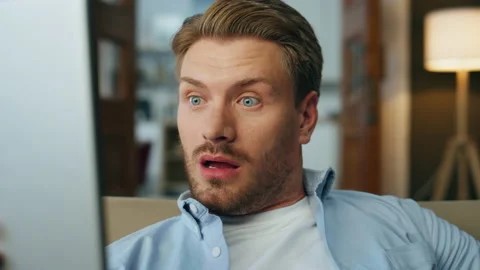 Wondering man surprised face reading tab... | Stock Video | Pond5