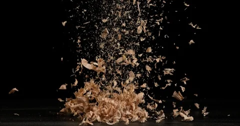 Wood Chips Falling against Black Backgro... | Stock Video | Pond5