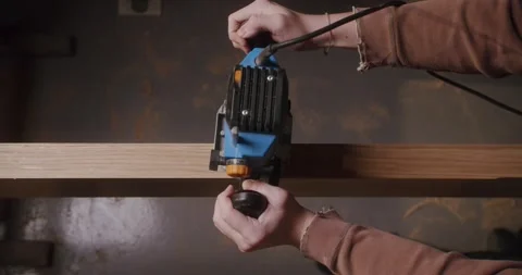 Wood grinding machine guided by hand on ... | Stock Video | Pond5