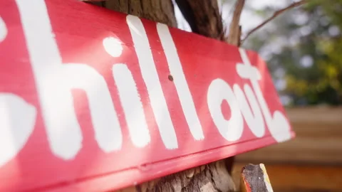 Wooden Chill Out Sign On A Tree Trunk | Stock Video | Pond5