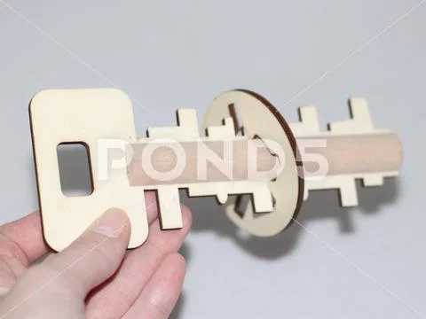 Photograph: Wooden key for the development of logic. Puzzle for ...