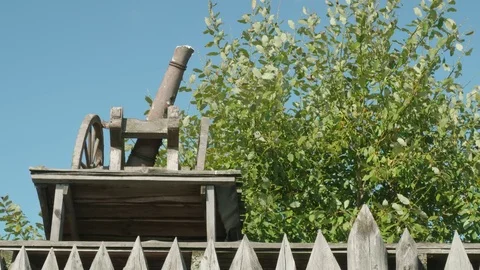 Wooden model of gun with blue sky and gr... | Stock Video | Pond5