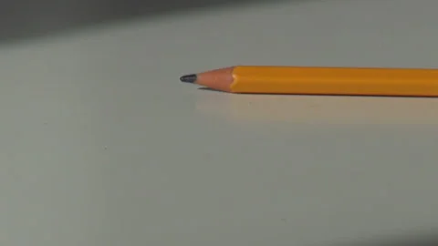 wooden pencil rolling on an office Desk | Stock Video | Pond5