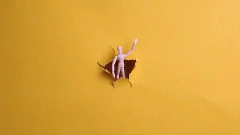 Wooden puppet peeking out of a hole on a... | Stock Video | Pond5