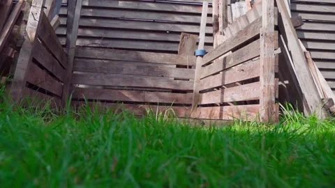 Wooden structure after the compost heap.... | Stock Video | Pond5