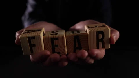 The word FEAR written on wooden cubes on... | Stock Video | Pond5