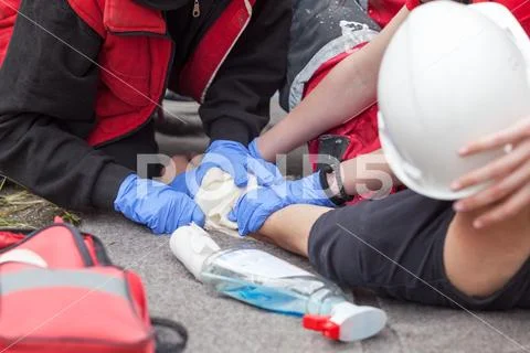 Work accident. First aid training. Arm injury. Stock Photo #125236930