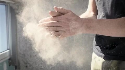 Worker claps his hands to dust off his h... | Stock Video | Pond5