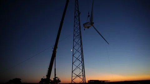 Worker climbing wind turbine tower | Stock Video | Pond5