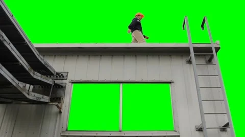 Worker Climbs Down Green Screen | Stock Video | Pond5