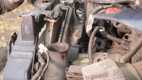 Worker detatches broken cooling radiator... | Stock Video | Pond5