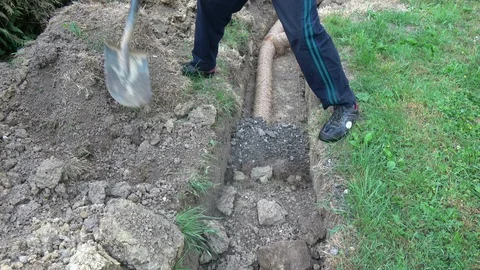worker fill up with ground soil drainag... | Stock Video | Pond5