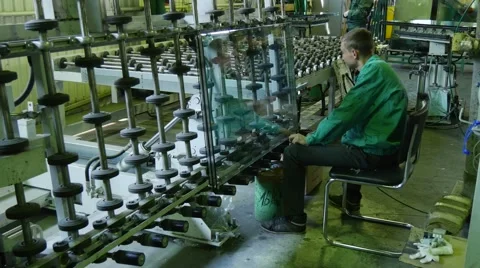 Worker in Green Uniform is Sitting at Th... | Stock Video | Pond5