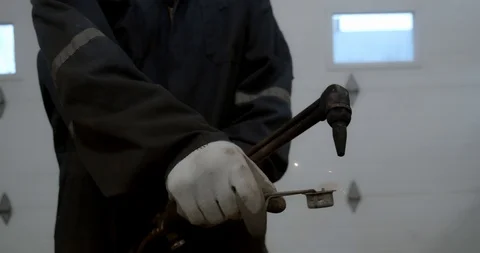 Worker lights a welding torch creating a... | Stock Video | Pond5