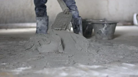 Worker mixing mortar for plaster a wall ... | Stock Video | Pond5