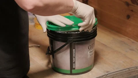 A worker open bucket the paint for paint... | Stock Video | Pond5