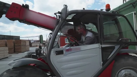 Worker Operates Industrial Loader Equipp... | Stock Video | Pond5
