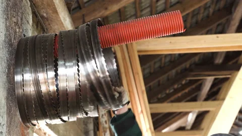 Worker puts bandsaw blade in a stack in ... | Stock Video | Pond5