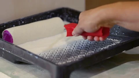 worker rolling paint roller in primer pa... | Stock Video | Pond5