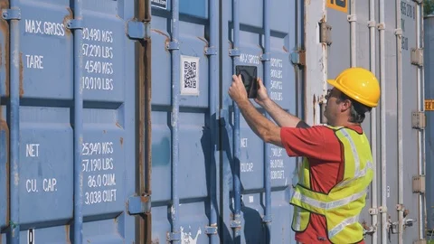 Worker Scanning a QR Code on a Shipping ... | Stock Video | Pond5