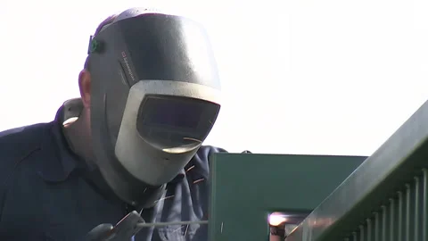 Worker welding a gate or door 4K | Stock Video | Pond5