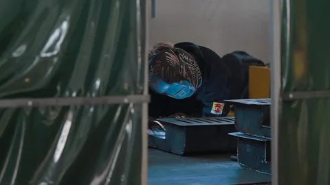 The worker with the welding mask inside ... | Stock Video | Pond5