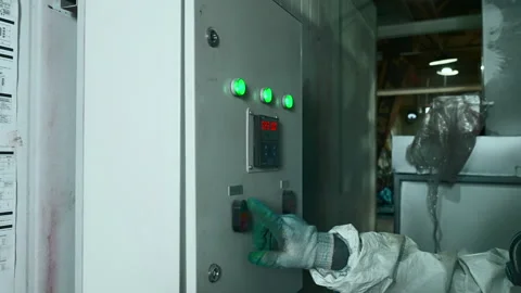 Worker in work uniform presses control p... | Stock Video | Pond5