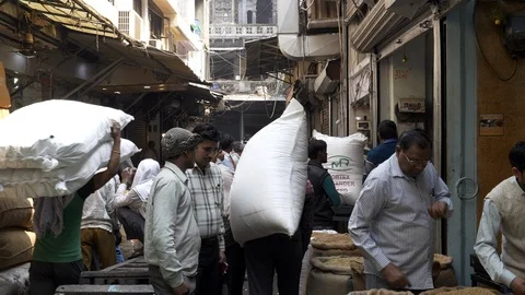 workers carrying bags of spices at the m... | Stock Video | Pond5