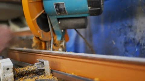 A worker's hands saw off segments from a... | Stock Video | Pond5